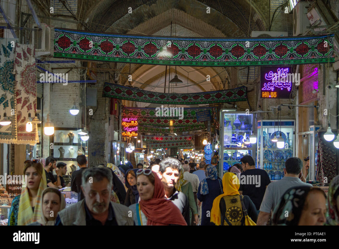 People walking through the Grand Bazaar in Imam Square in Isfahan, Iran ...