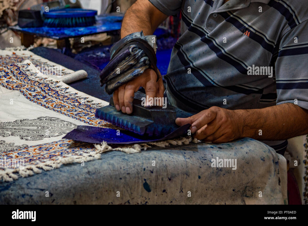 A man hand printing a Persian Rug in the Grand Bazaar at Imam Square in ...