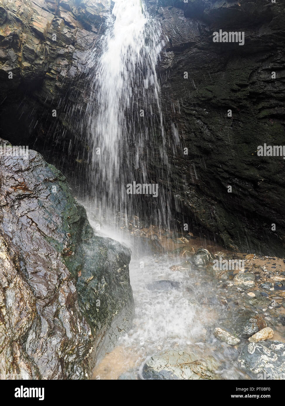 waterfall over rocks in slow motion blur Stock Photo - Alamy