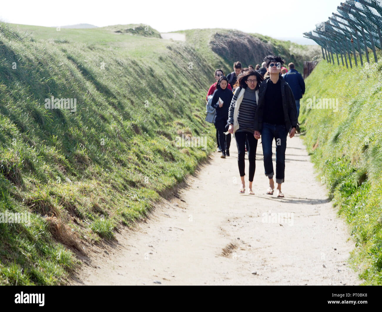 Asian tourist couples in Cornwall UK Stock Photo - Alamy