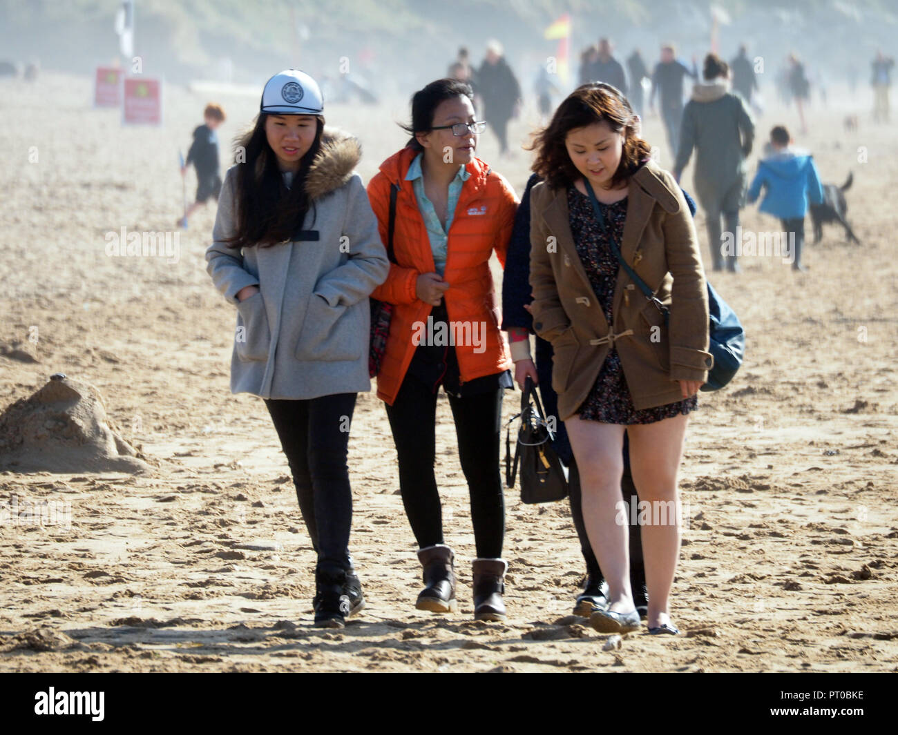 Asian tourist couples in Cornwall UK Stock Photo - Alamy