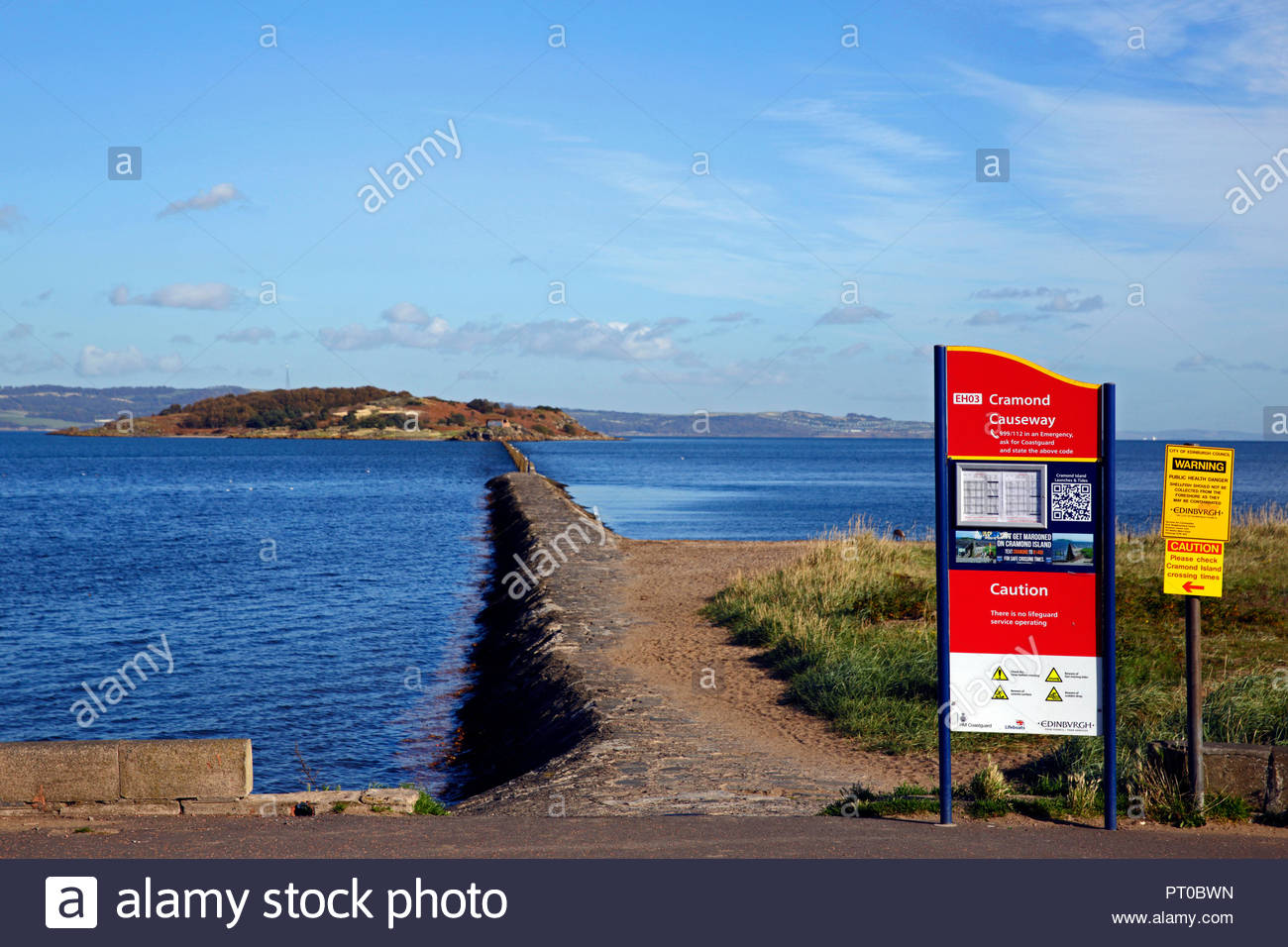 A view along the Cramond Causeway to Cramond Island in the Forth ...