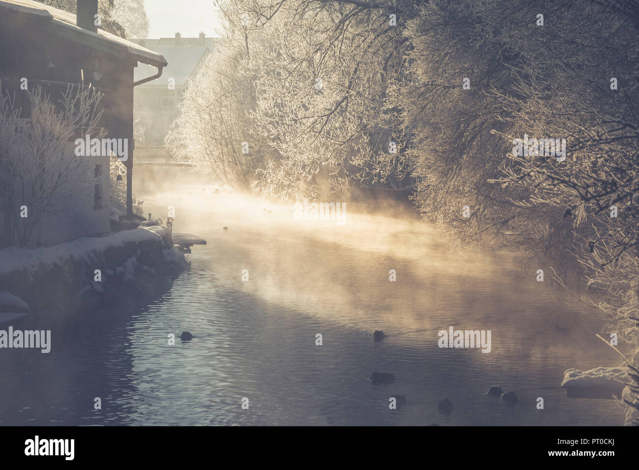 A brook scene in winter, with ice, snow and blue sky Stock Photo - Alamy