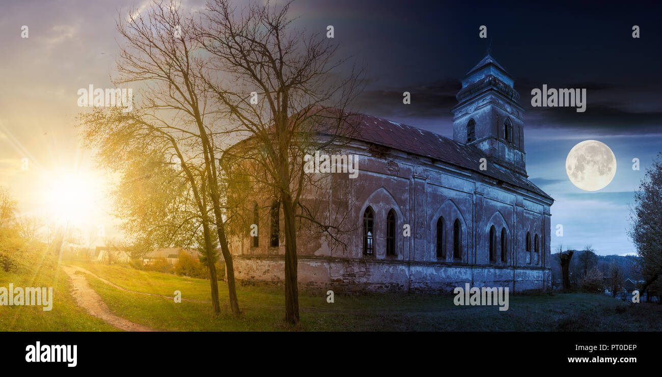 time change concept with sun and moon. panorama of abandoned catholic ...