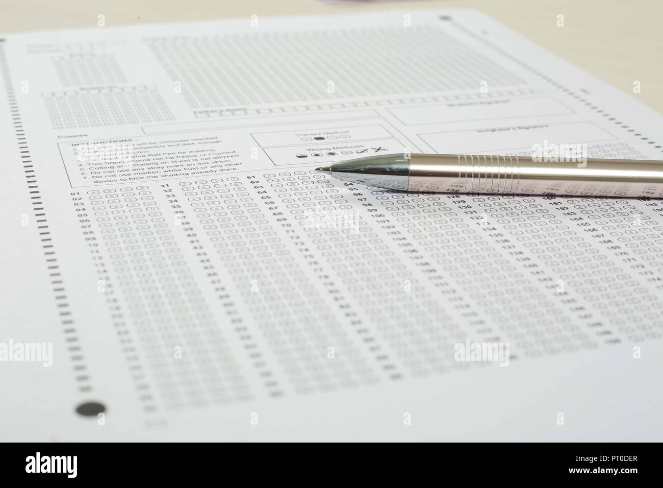 Picture of exam sheet and pen. Isolated on white background Stock Photo ...