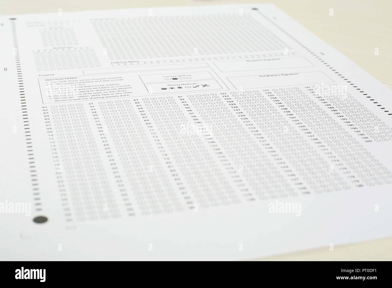 Picture of exam sheet. Isolated on white background Stock Photo - Alamy