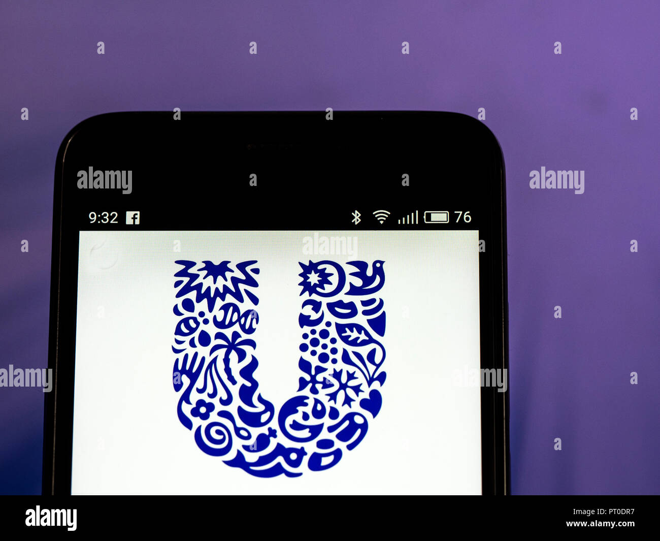 Unilever logo seen displayed on smart phone. Unilever is a British ...