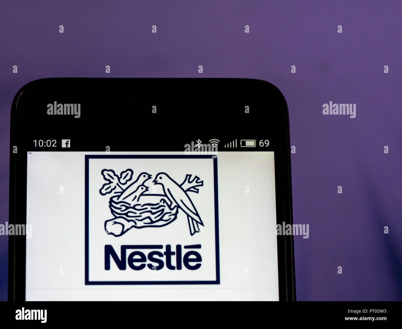 Nestle logo seen displayed on smart phone. Nestle S.A. is a Swiss ...