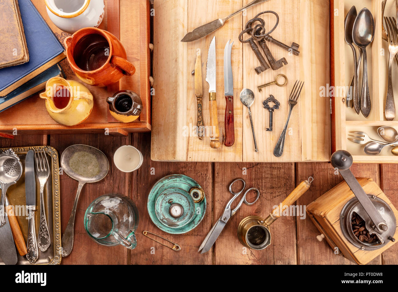 An overhead photo of many vintage objects, flea market stuff on a ...