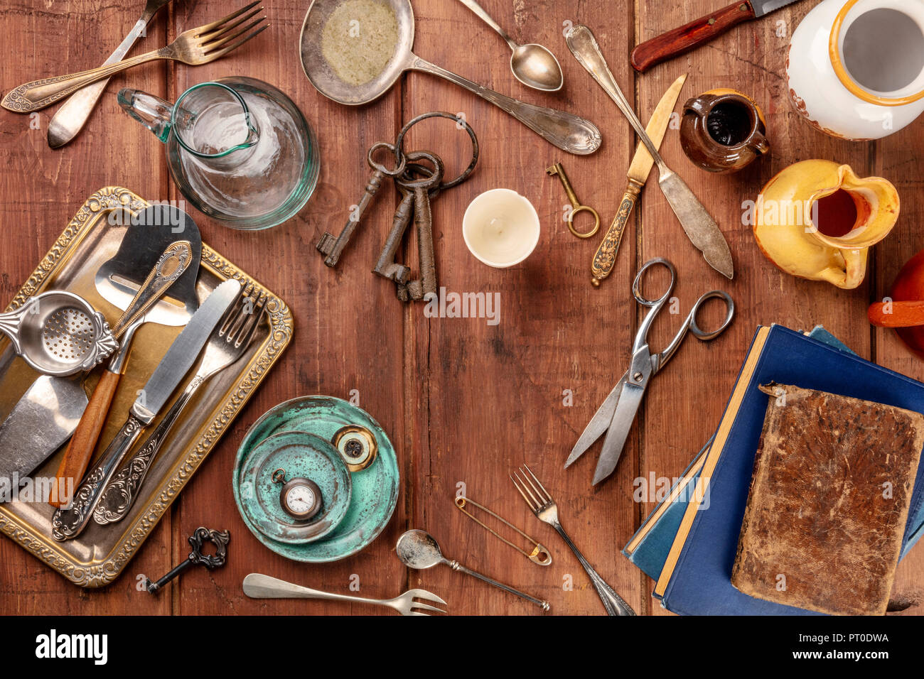 An overhead photo of many vintage objects, flea market stuff on a ...