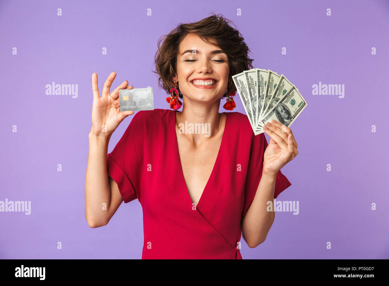 Photo of happy rich woman 20s wearing big straw hat smiling while ...