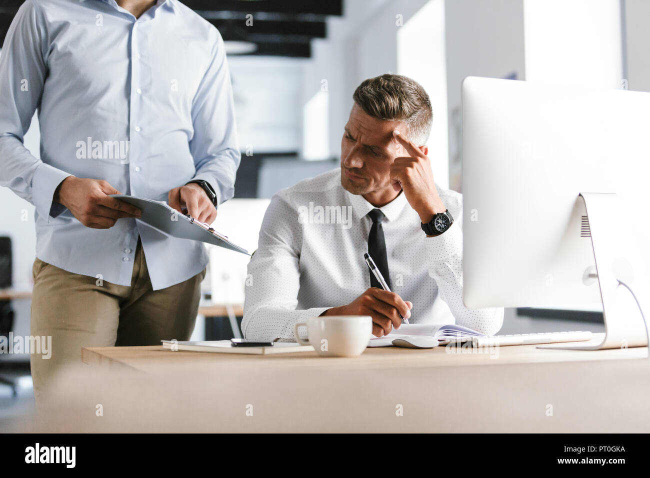 Image of adult employer man 30s in formal clothes working on computer ...