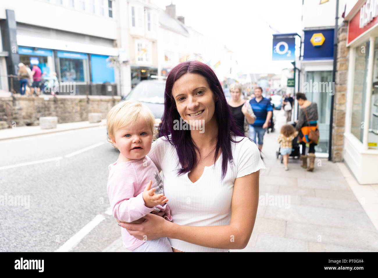 A mother and her daughter on the high street in Penzance, Cornwall ...