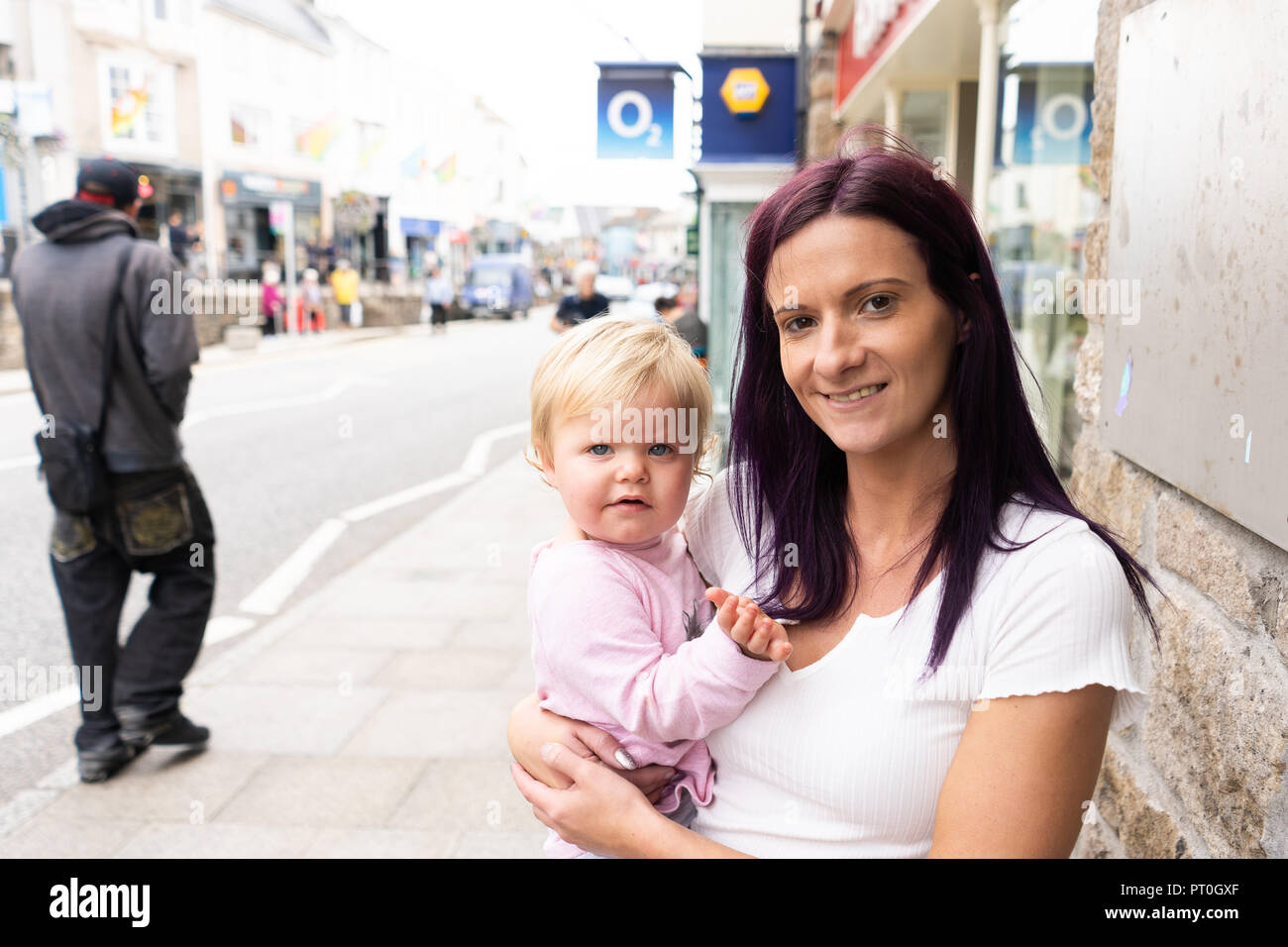 A mother and her daughter on the high street in Penzance, Cornwall ...