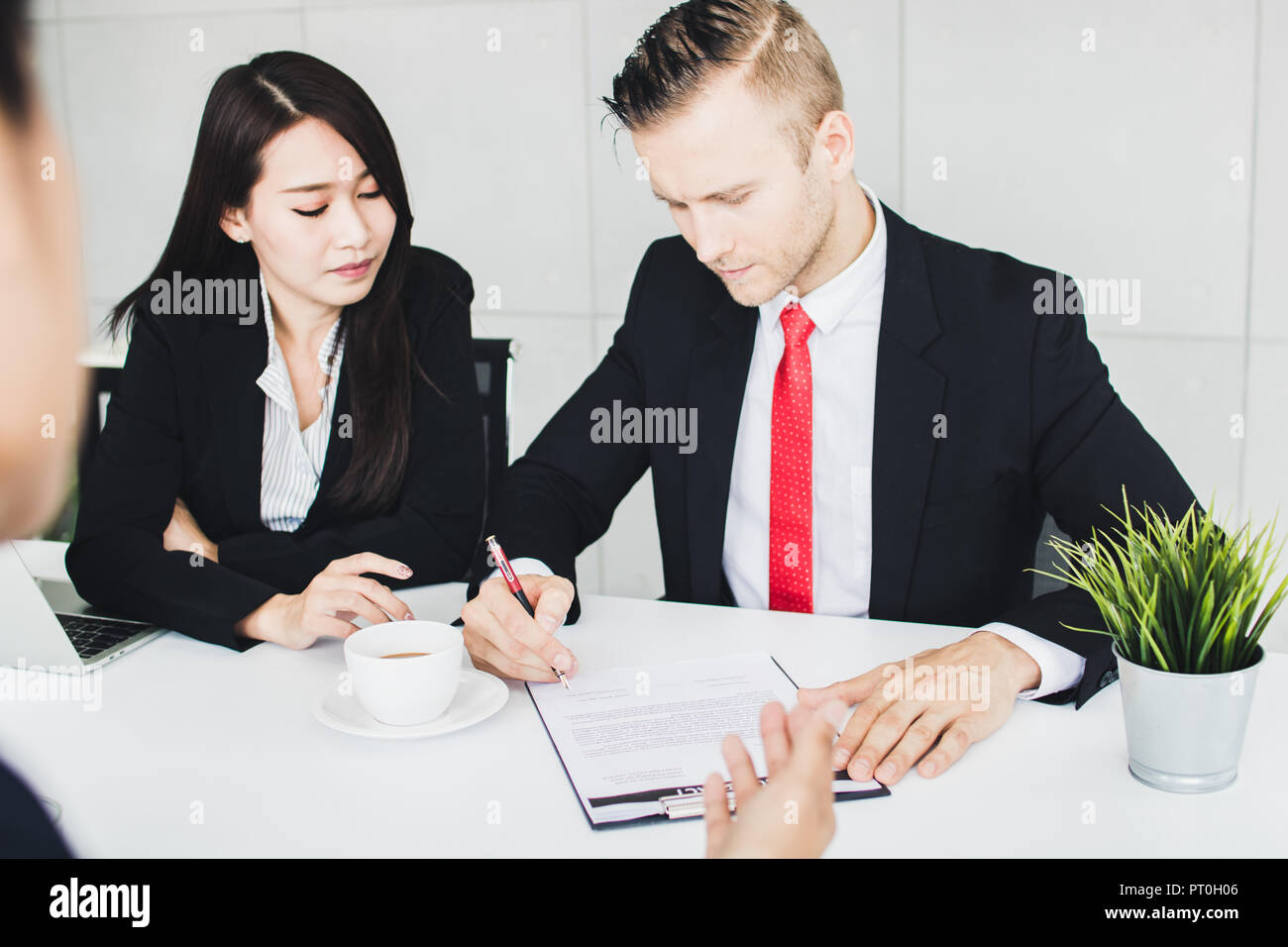 Business people reading clearly before signing on contract in meeting ...