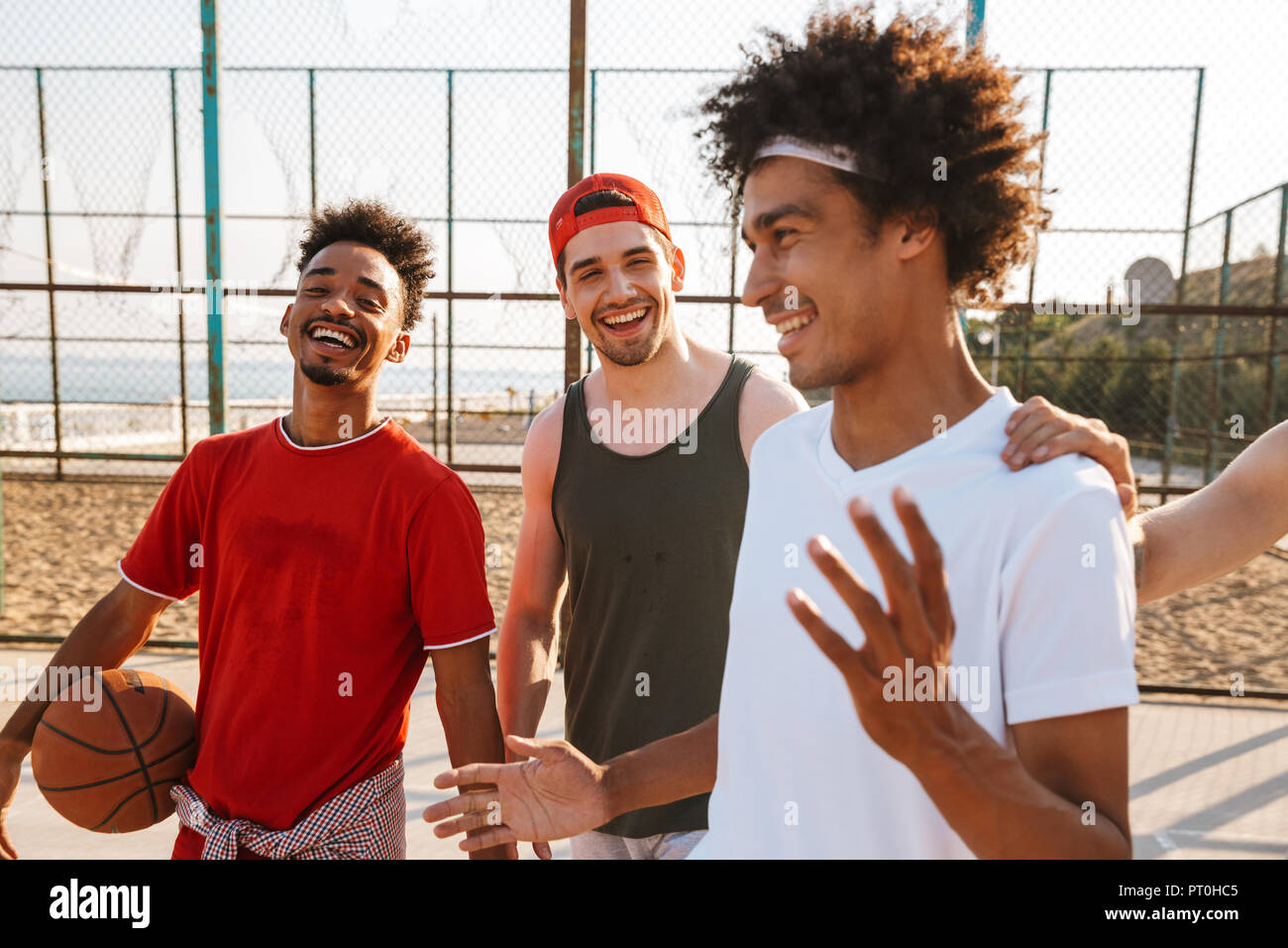 Group young guys playing basketball hi-res stock photography and images ...