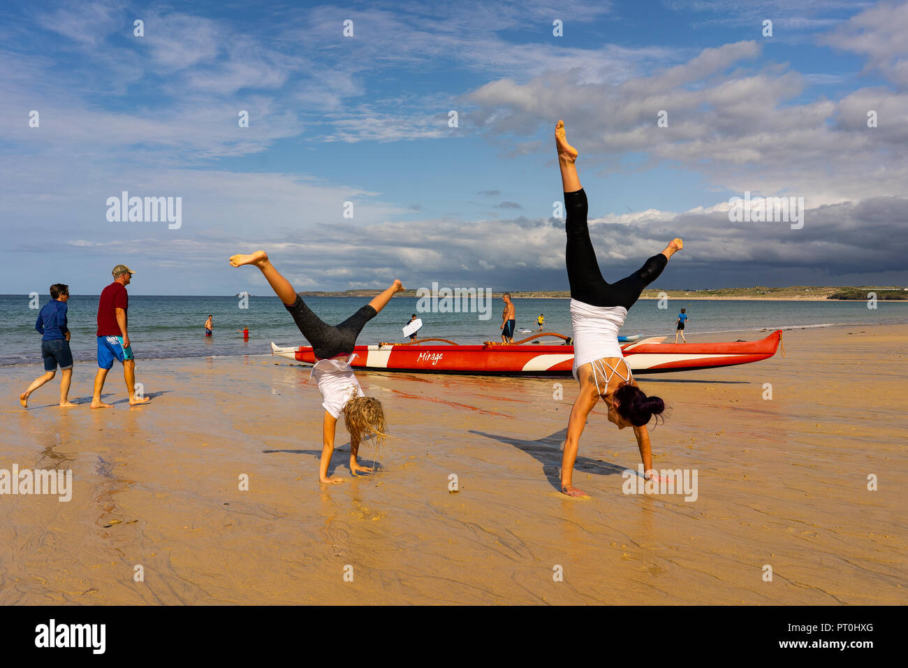 Mother and daughter having fun at the beautiful Carbis Bay in St Ives ...