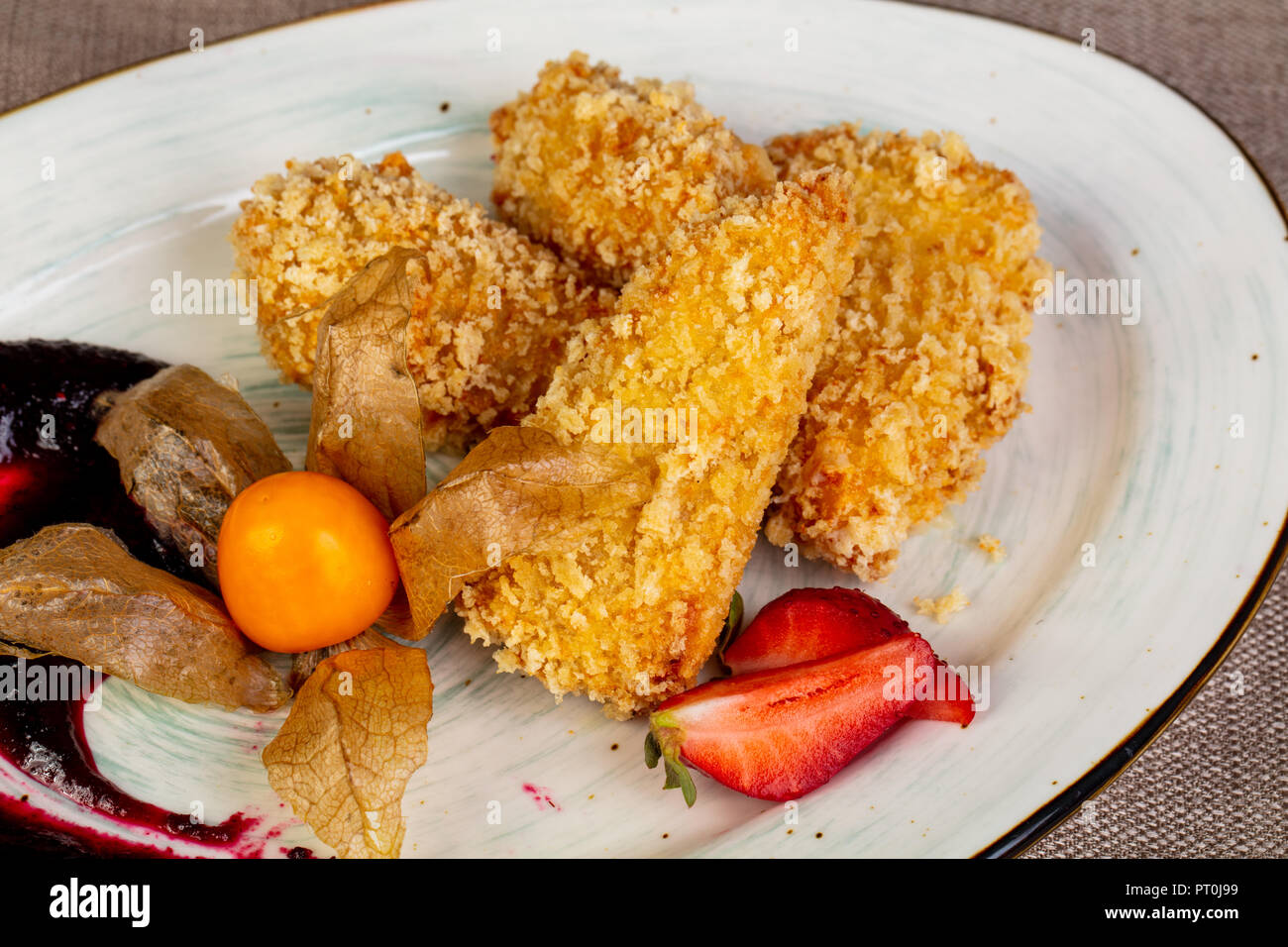 Roasted cheese sticks with jam Stock Photo - Alamy