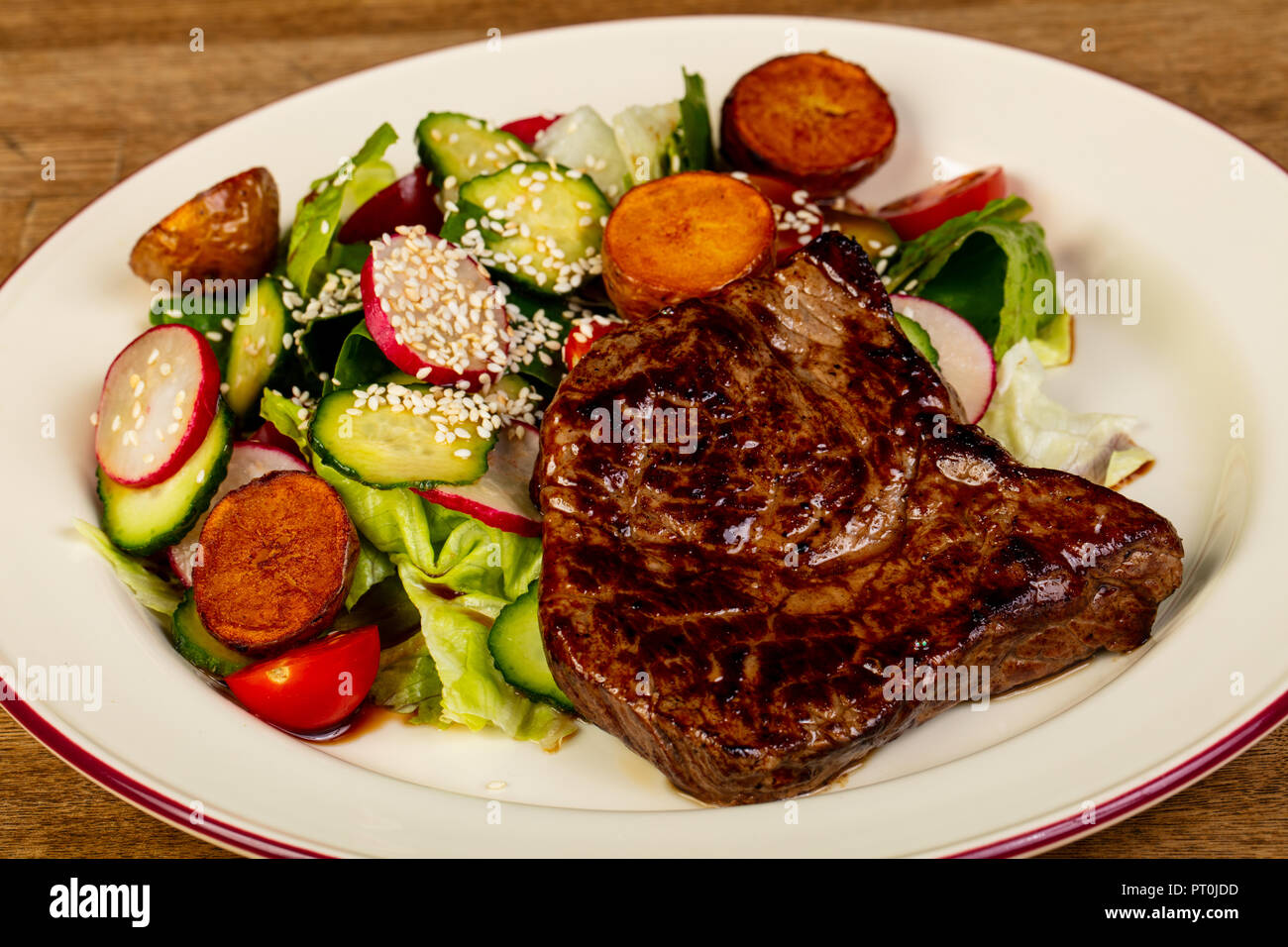 Beef steak salad with radish Stock Photo - Alamy