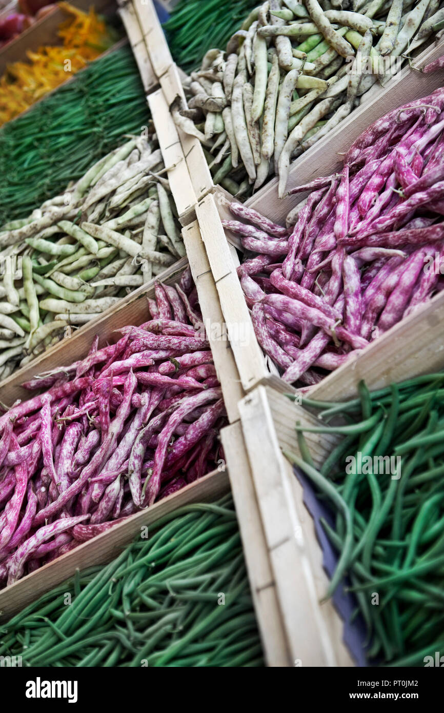 Various beans in wooden crates on a stall Stock Photo - Alamy