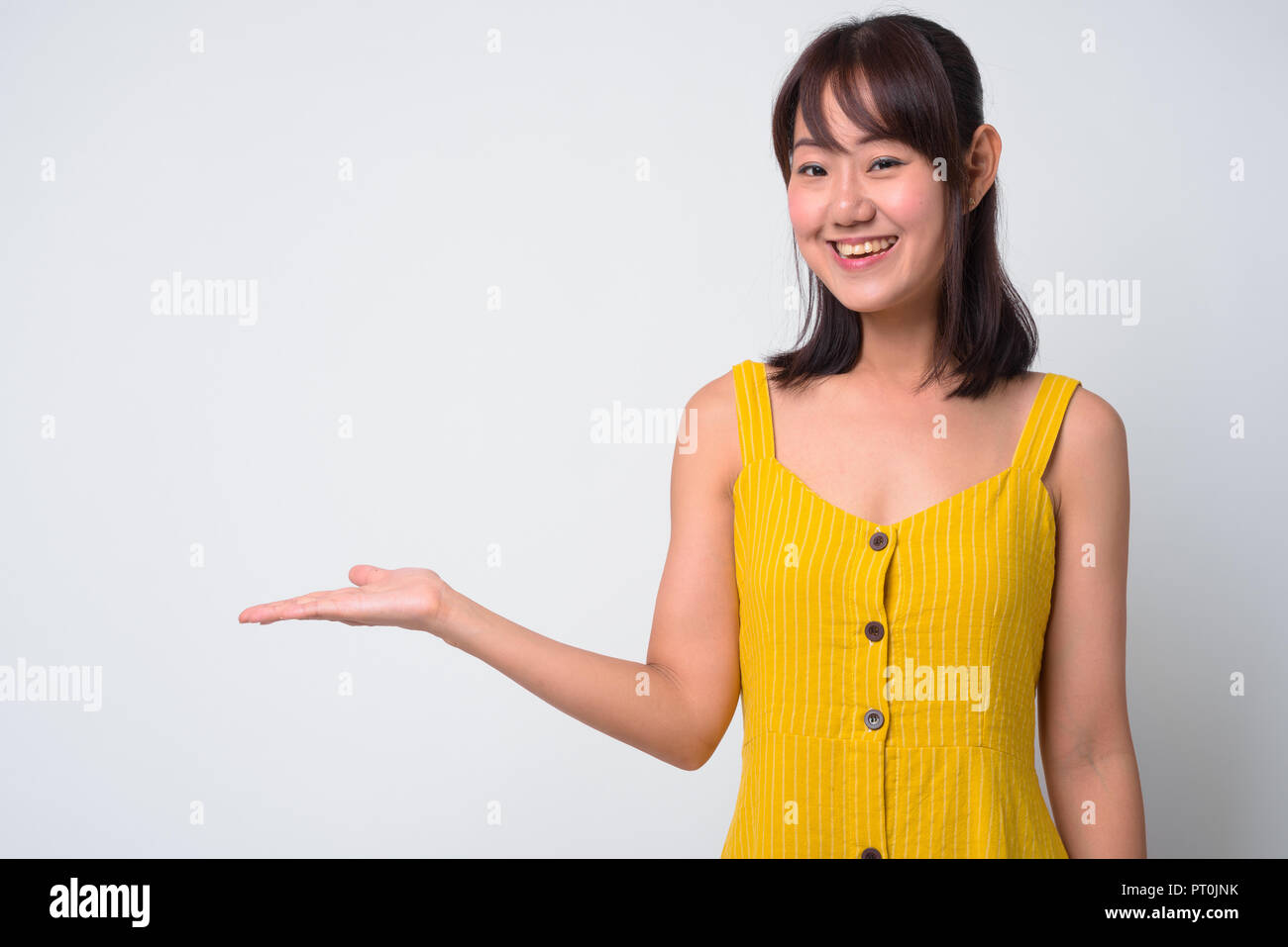 Portrait of beautiful Asian woman wearing yellow dress Stock Photo - Alamy