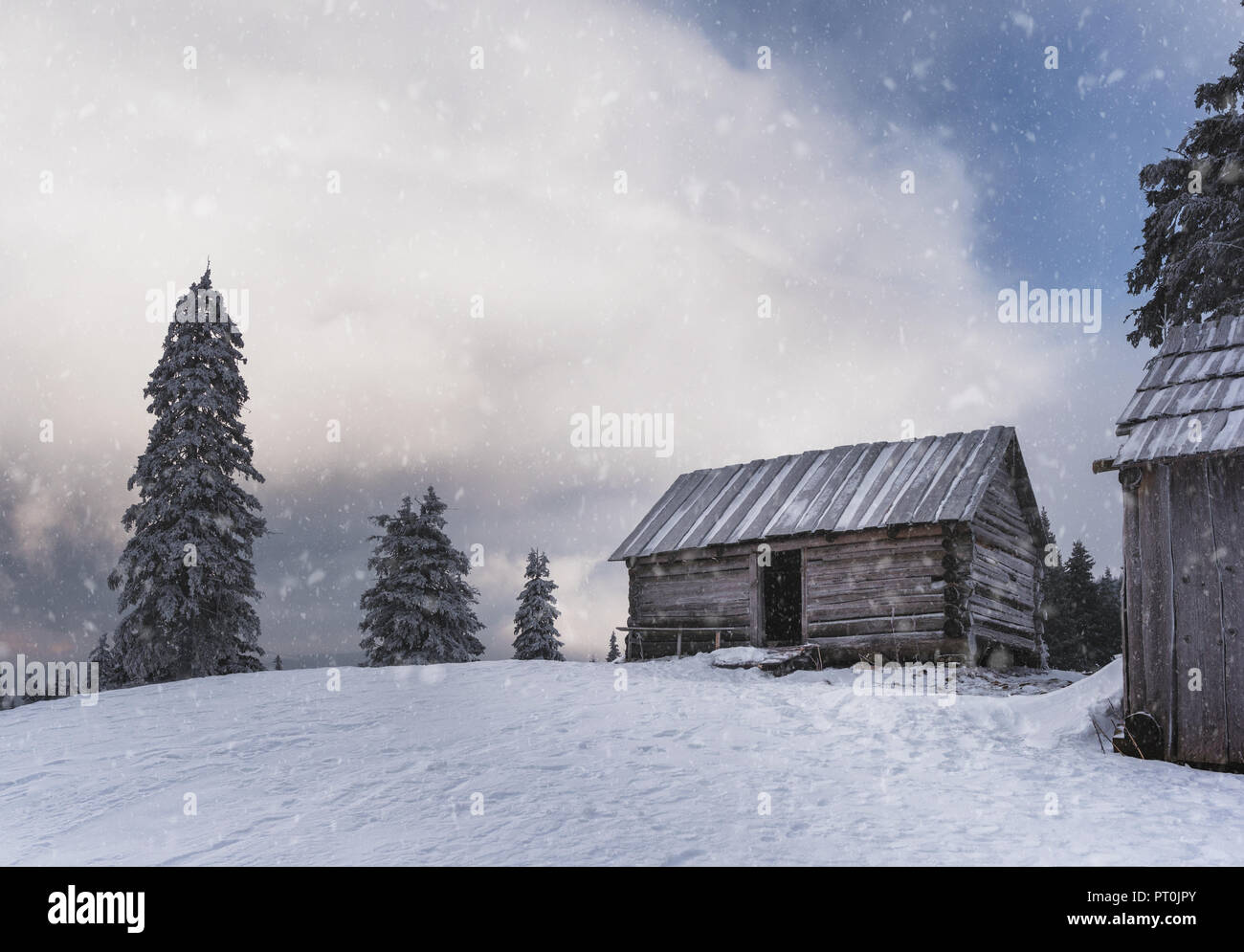 Lonely empty house on the mountain hill during snowfall Stock Photo - Alamy