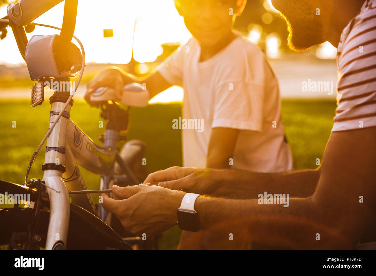 Cropped image of joyful father and his son having fun together at the ...