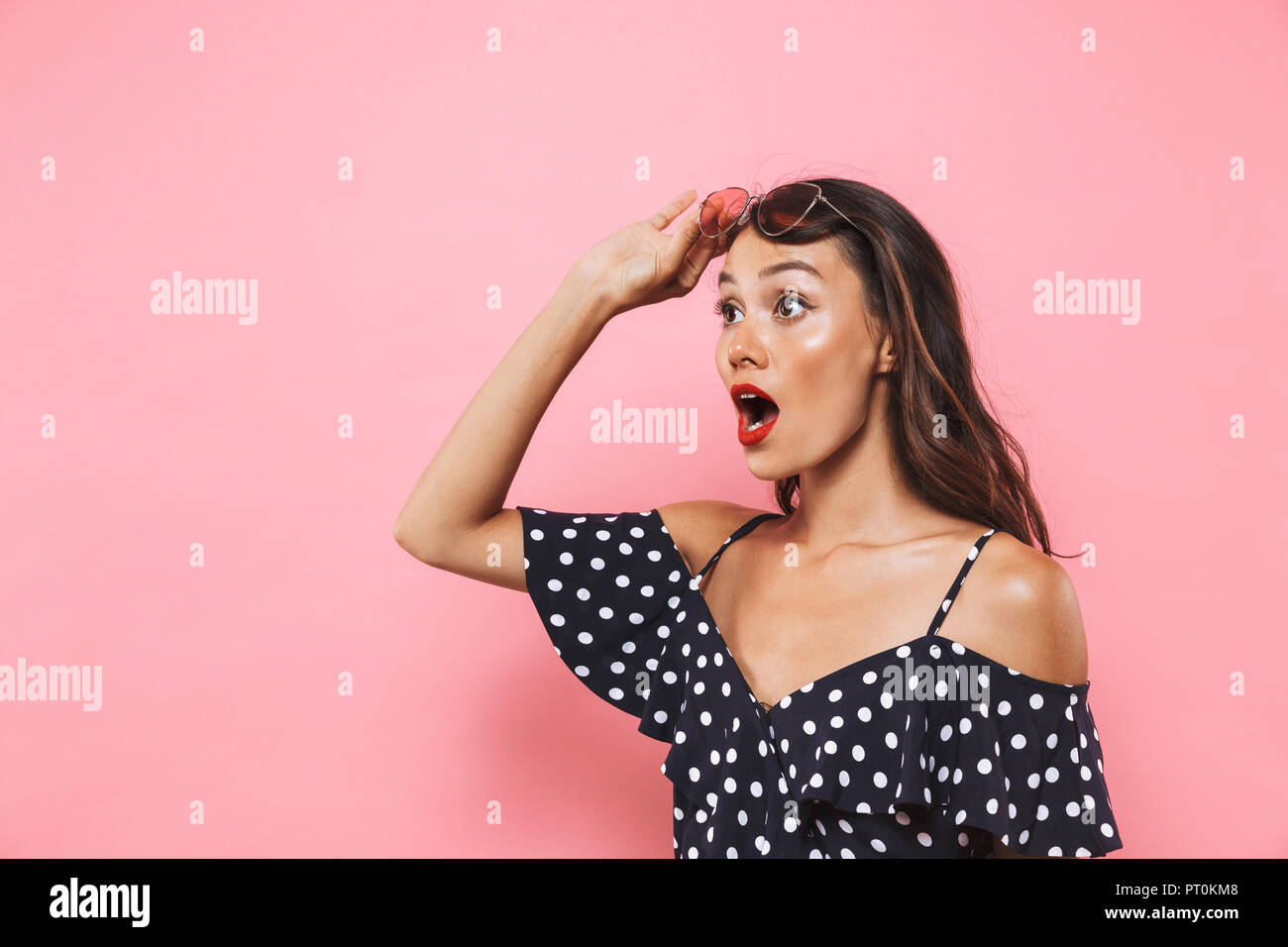 Shocked Brunette Woman In Dress Take Off Sunglasses And Looking Away