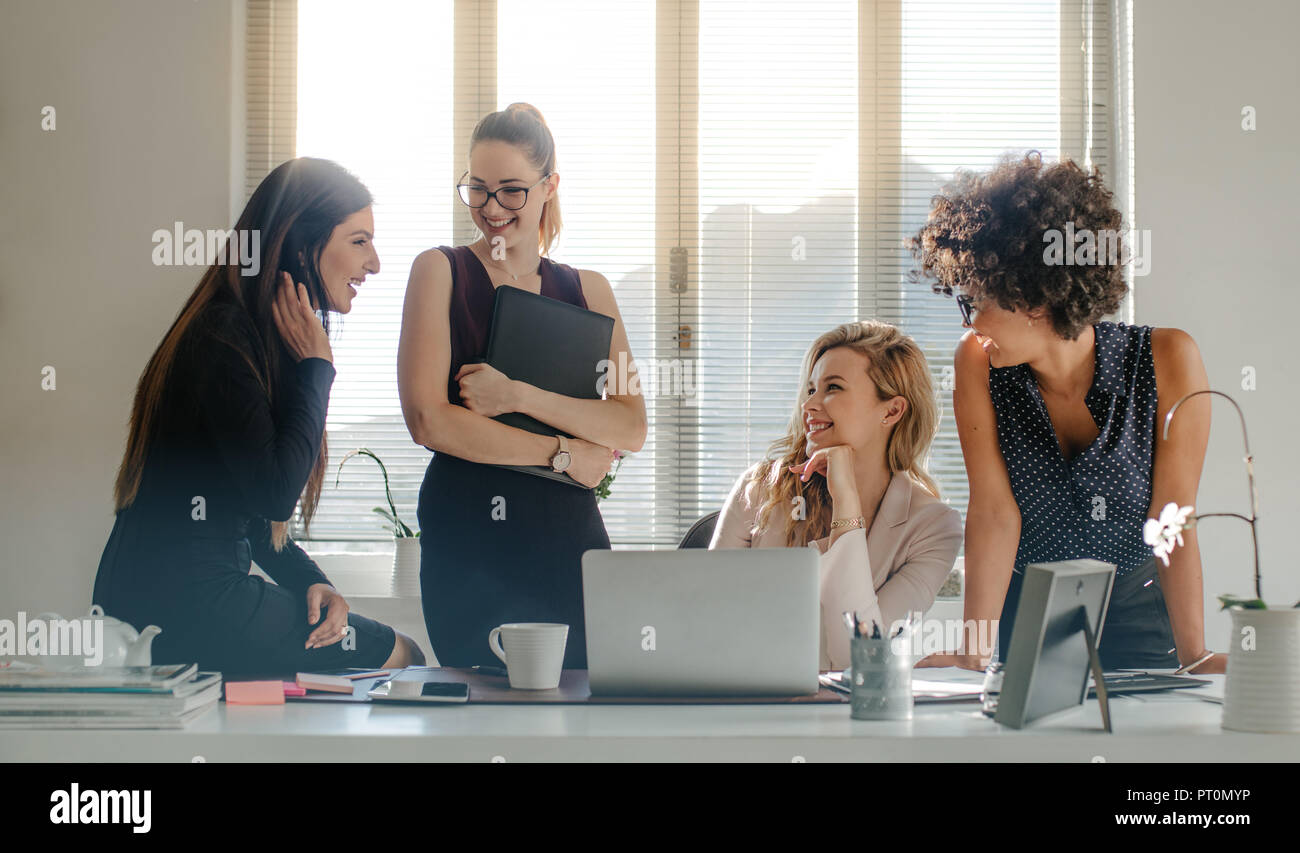 Group of multi-ethnic businesswoman having a casual discussion in ...