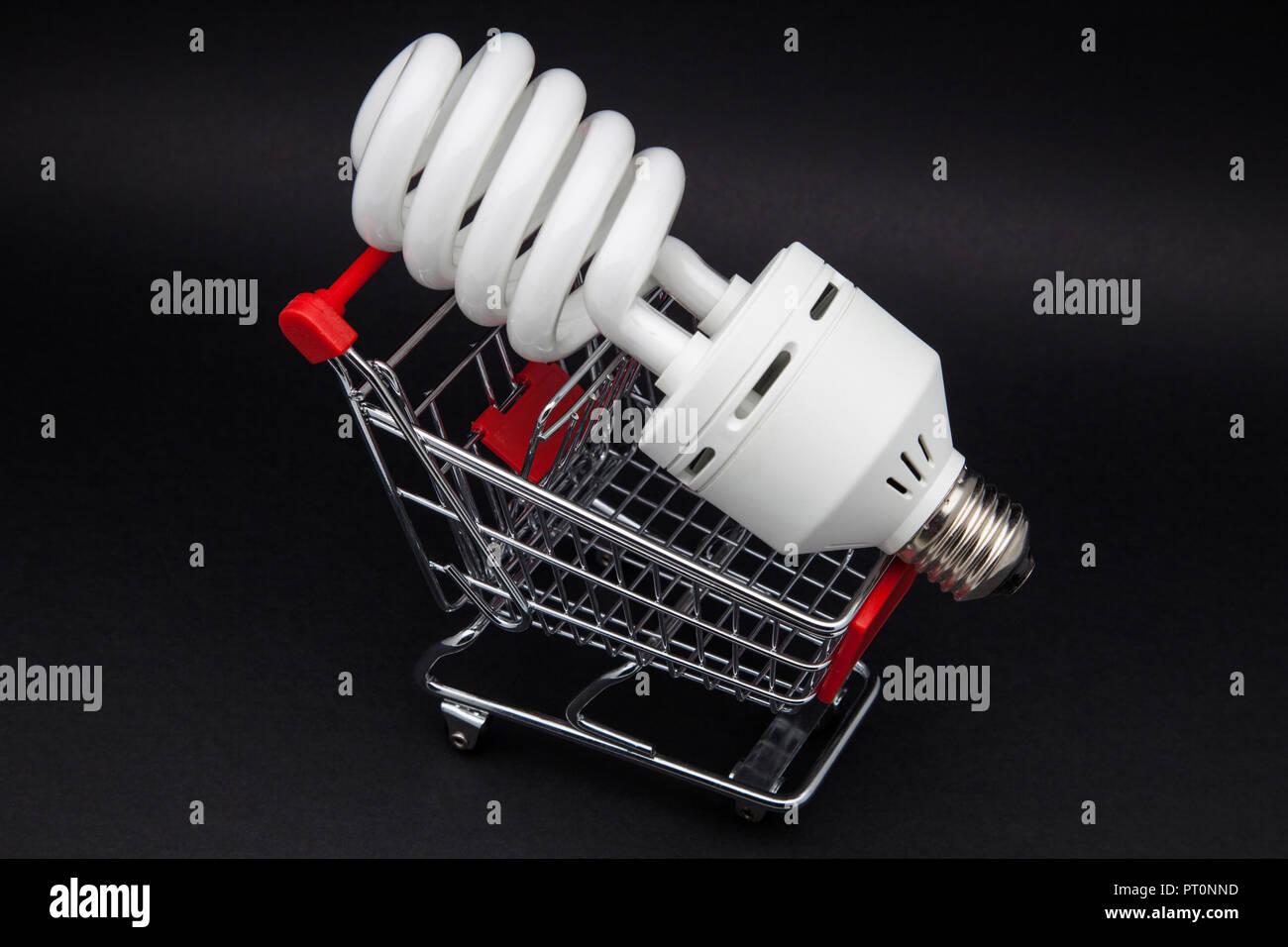 shopping cart with light on a black background Stock Photo - Alamy