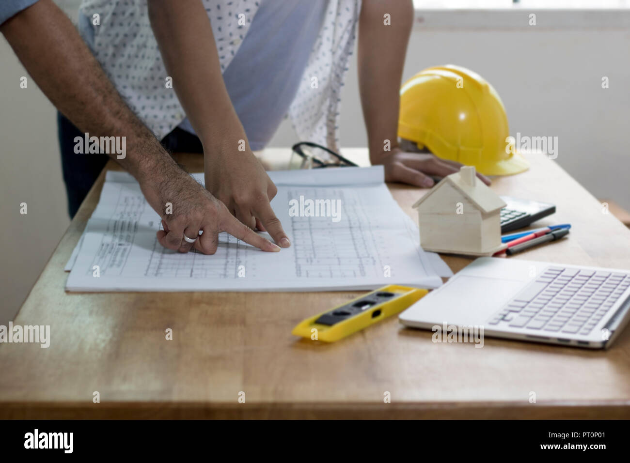 engineer discuss and planning on working table Stock Photo - Alamy