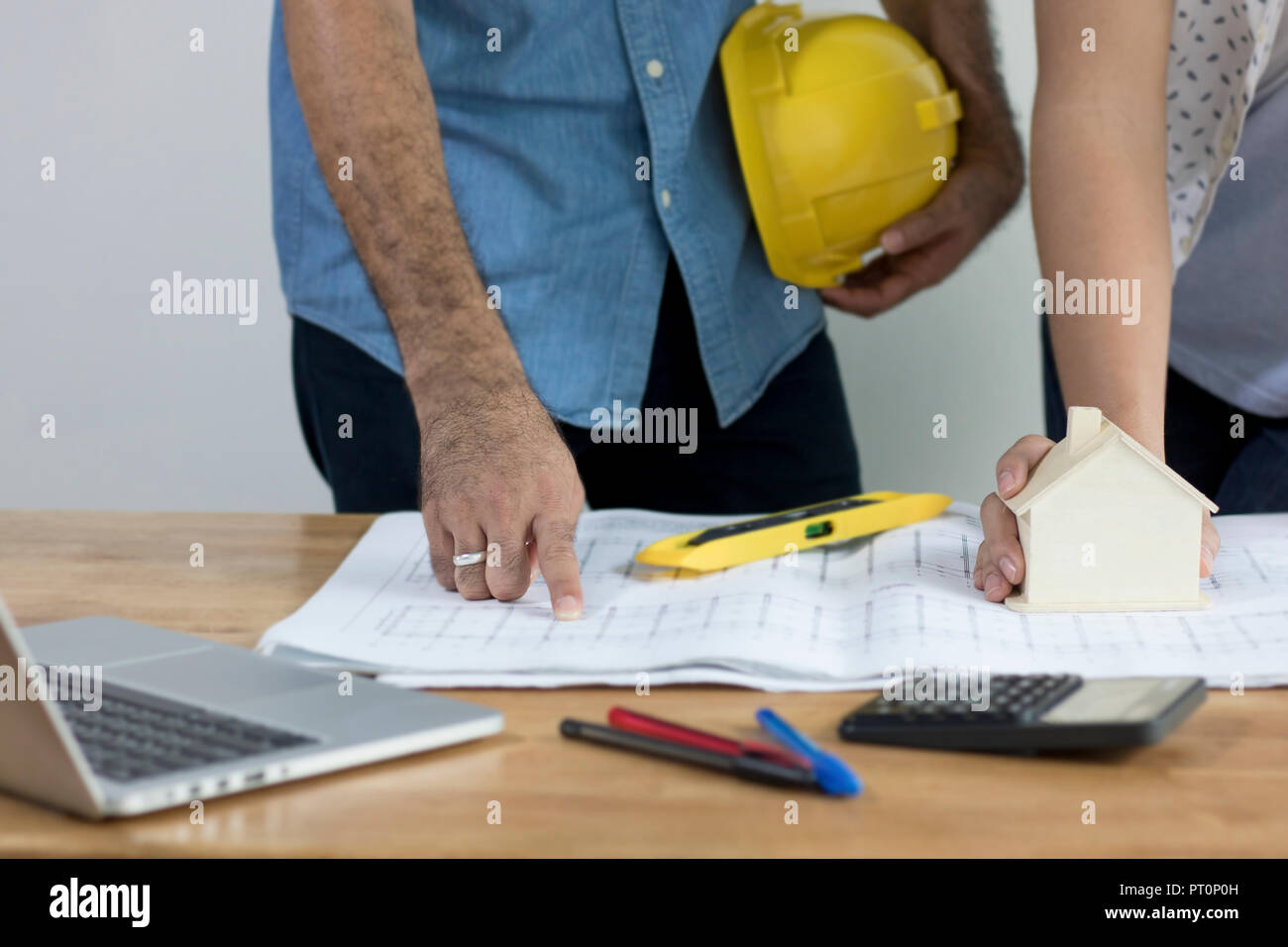 engineer discuss and planning on working table Stock Photo - Alamy