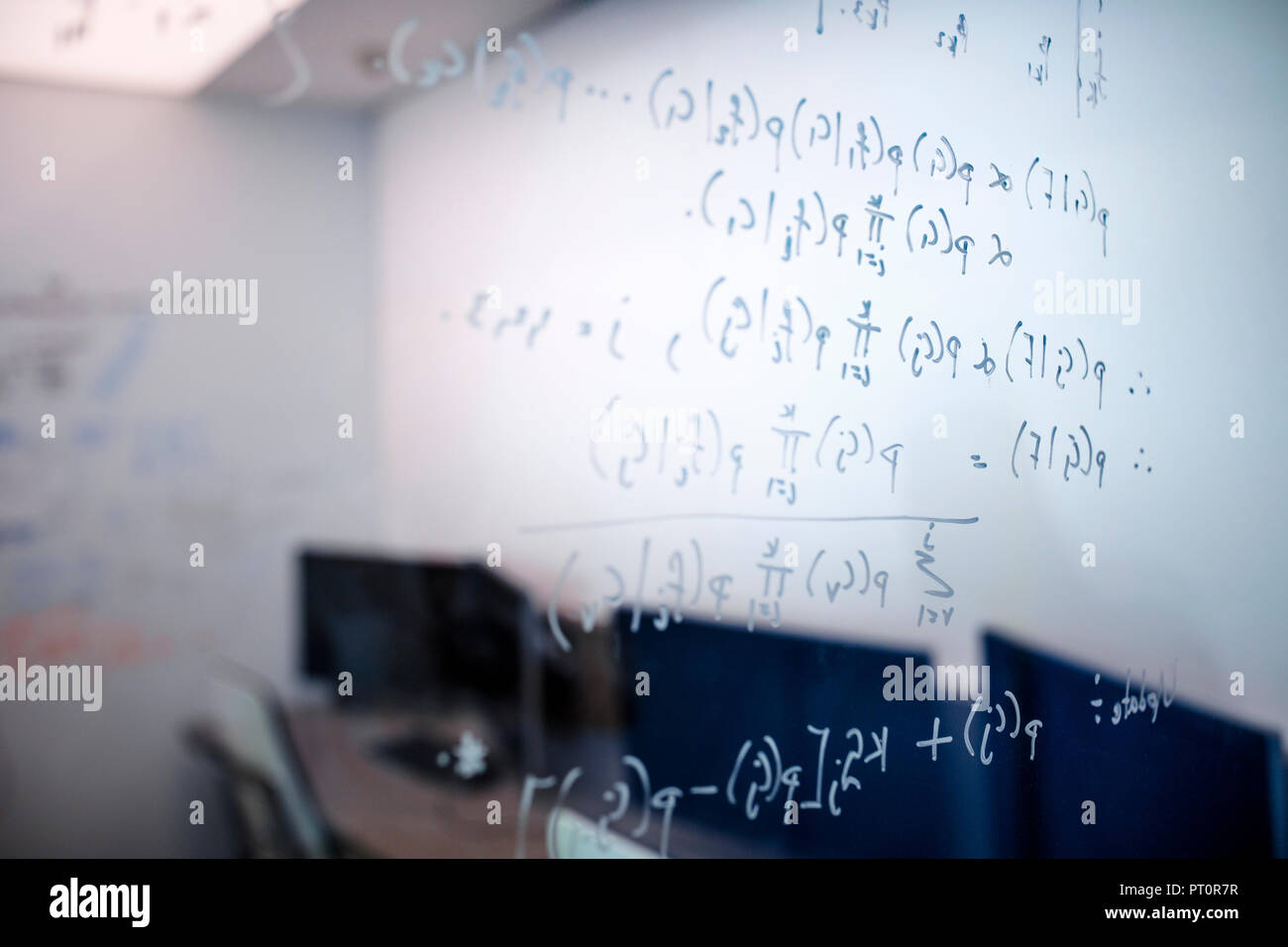 Mathematical formula on a glass pane in an office Stock Photo - Alamy