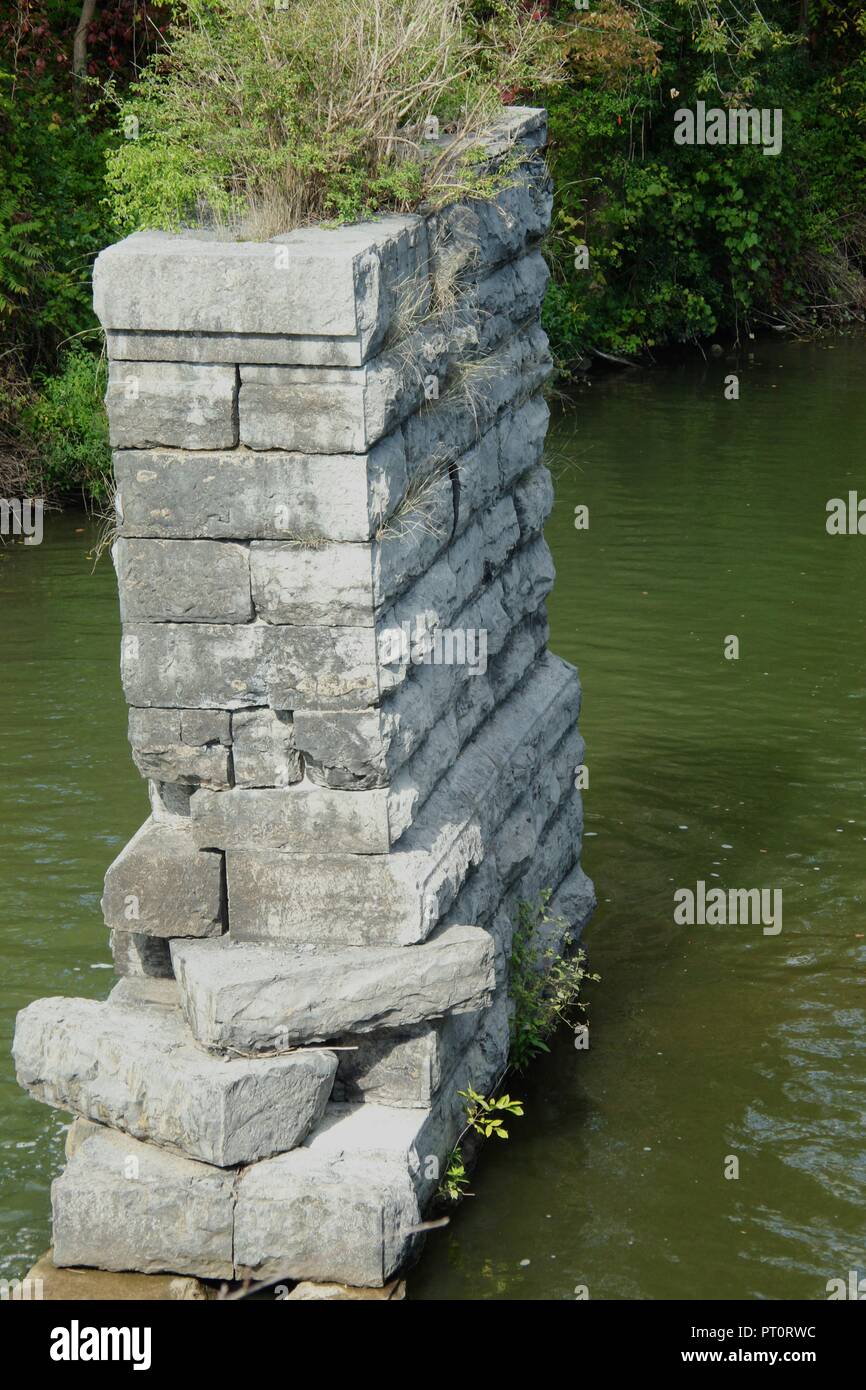 Rock structure on the left side of a river, shot from a nearby bridge ...