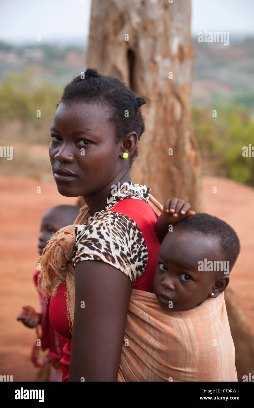 Mother carrying child on back hi-res stock photography and images - Alamy