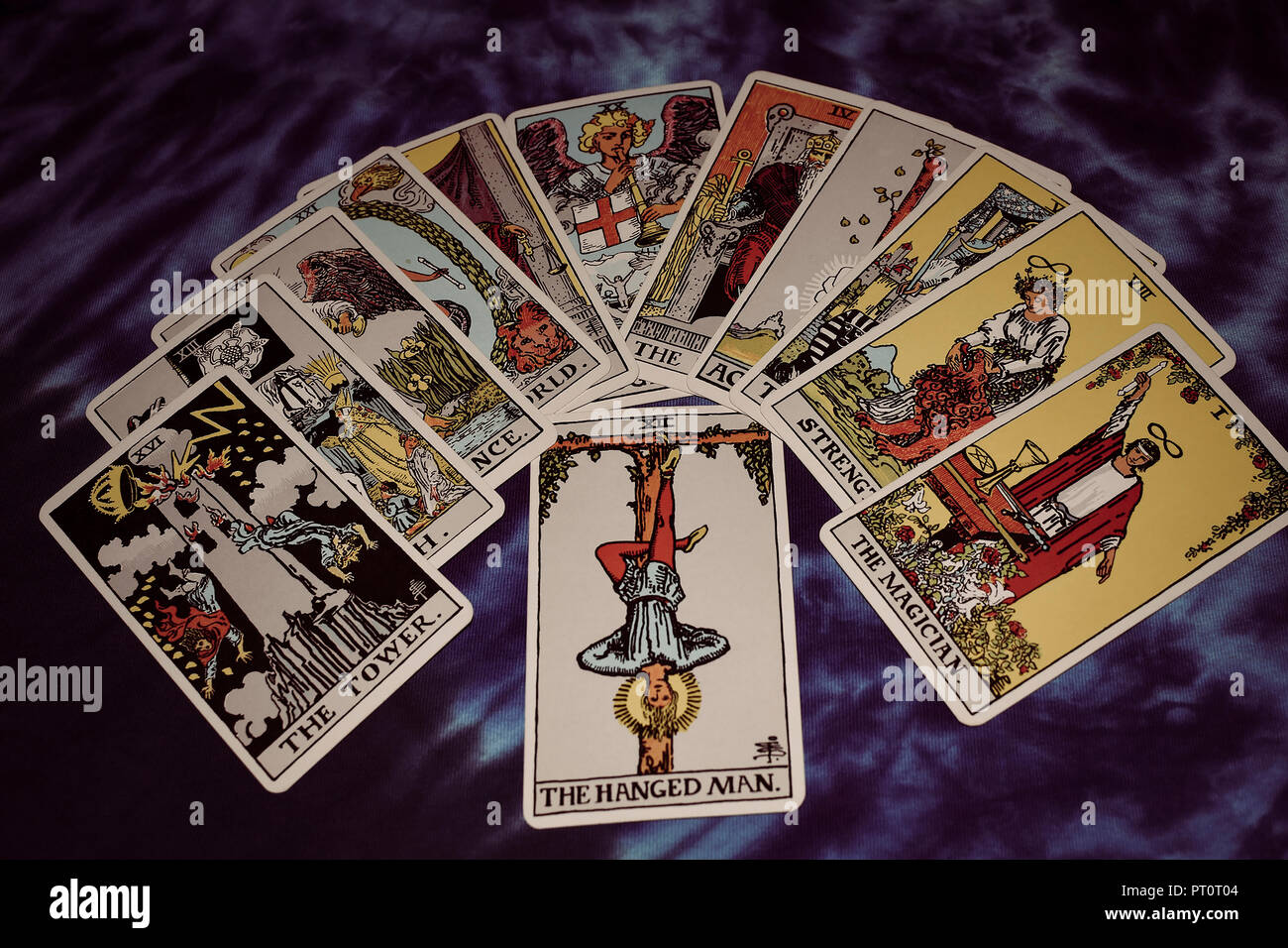 Tarot Cards the hanging man on purple background Stock Photo - Alamy