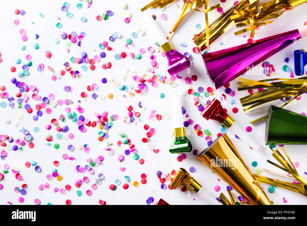 Party background. Party caps and confetti on white background. Top view ...