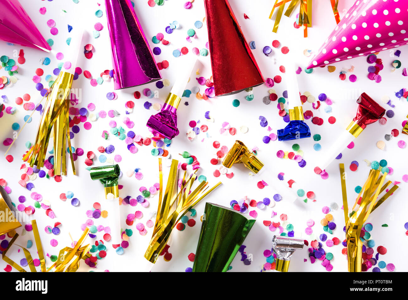 Party background. Party caps and confetti on white background. Top view ...