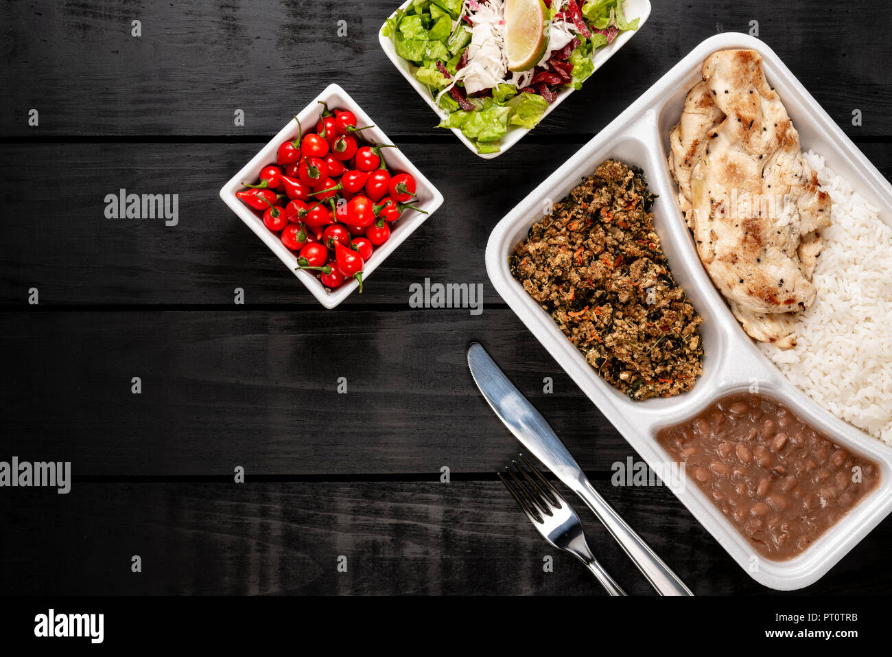 white rice chicken beans and manioc flour. Brazilian lunch box. top ...