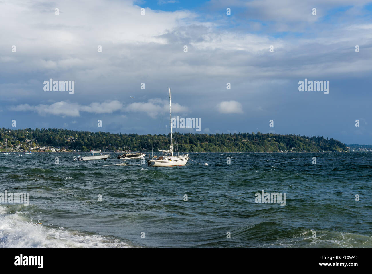 Boats are anchored at Three Tree Point in Burien, Washington on a windy ...