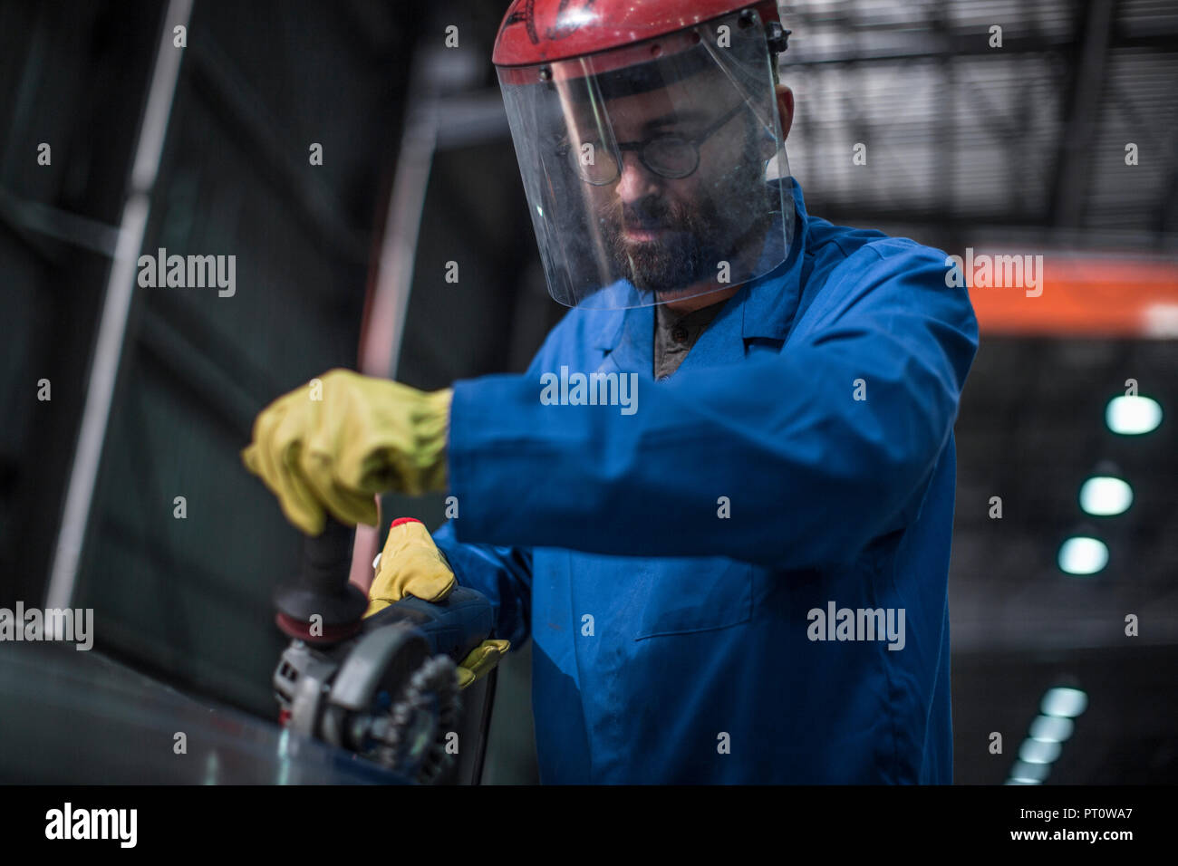 Worker working in steel factory Stock Photo - Alamy