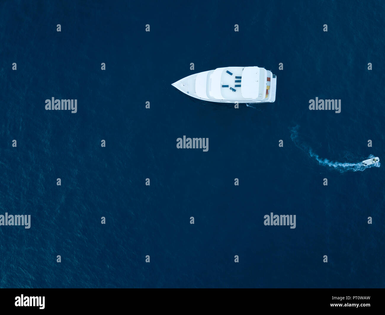 Maldives, Aerial view of yacht and small boat Stock Photo - Alamy