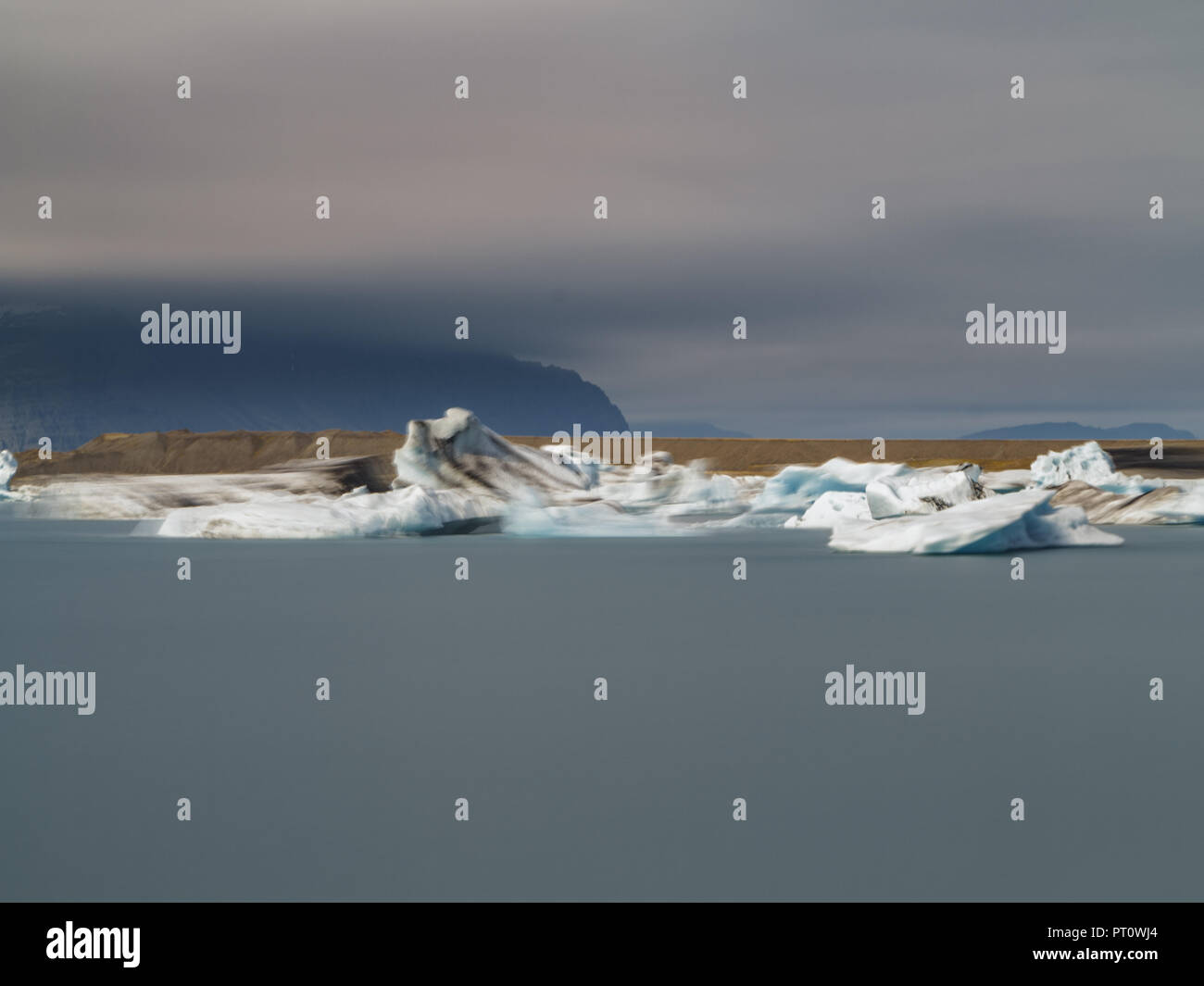 blue icebergs, lagoon and storm ultra long exposure Stock Photo - Alamy