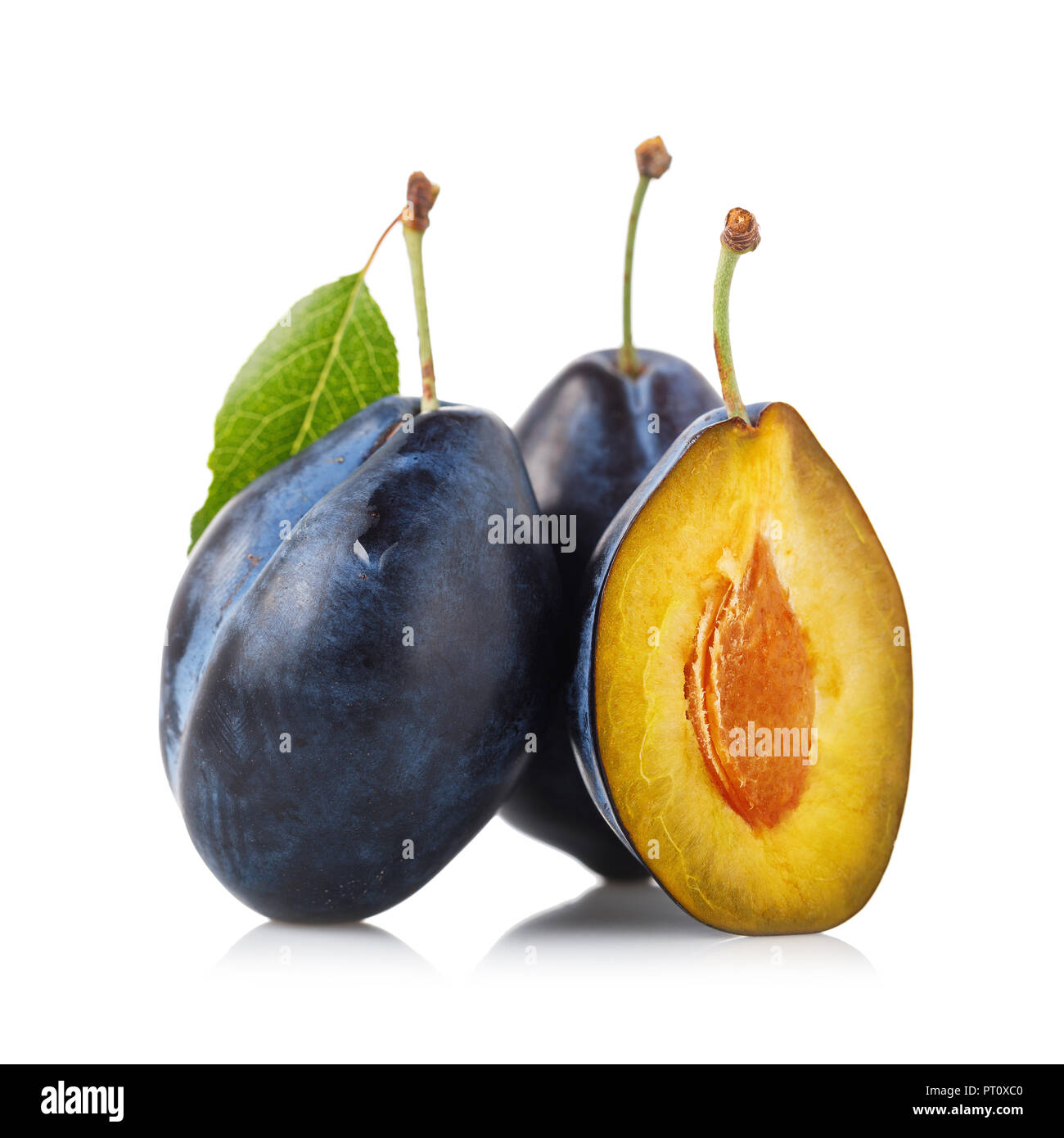 Three ripe fruit prunes isolated on white background Stock Photo - Alamy