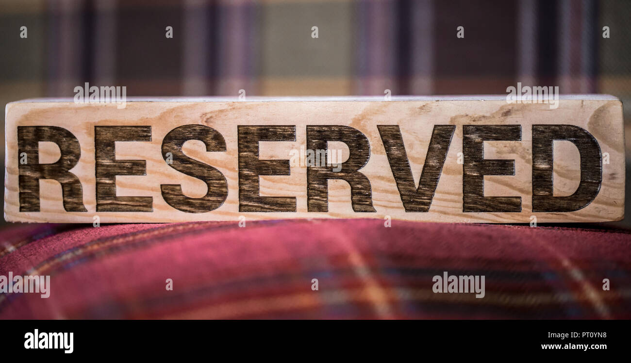 wooden sign saying reserved,close-up ,background ,concept hotels and ...