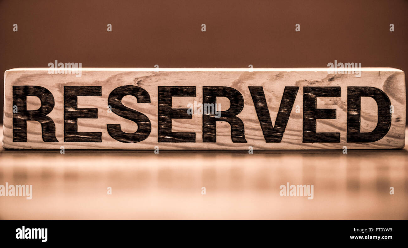 wooden sign saying reserved,close-up ,background ,concept hotels and ...