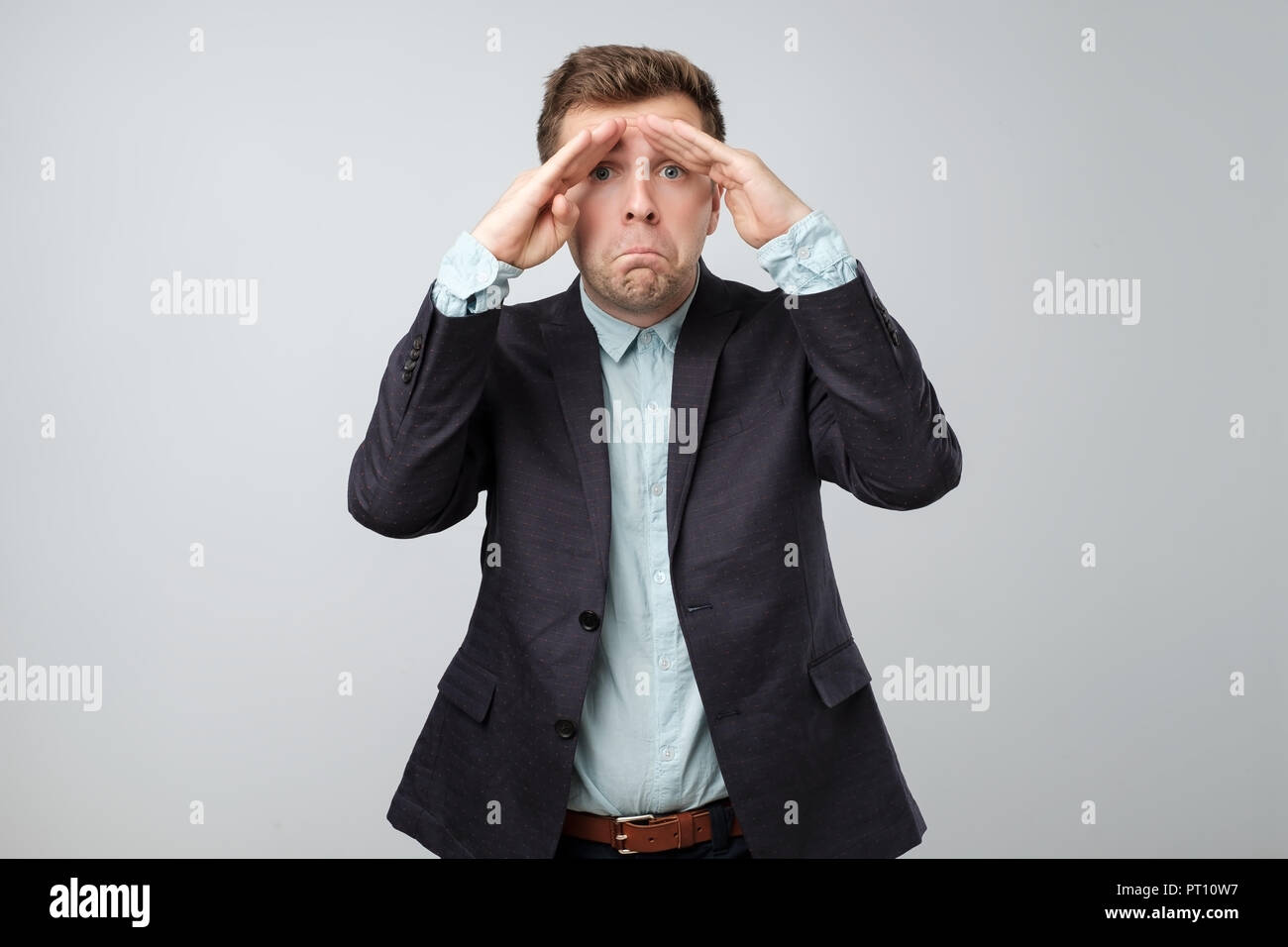 Stressed frustrated man looks displeased making depressed face Stock ...