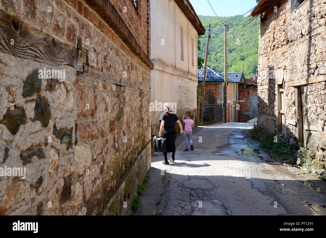an old women walks through the rural town of vevcani macedonia famous ...