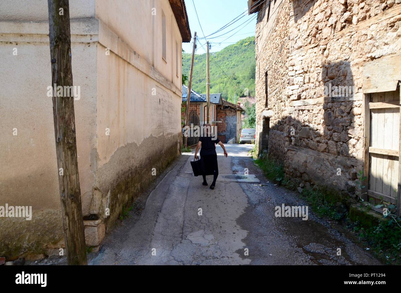 an old women walks through the rural town of vevcani macedonia famous ...