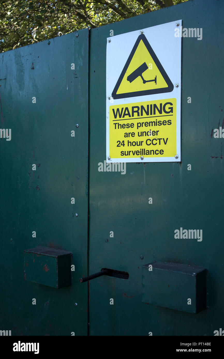 Warning Sign: These premises are under 24 hour surveillance Stock Photo ...